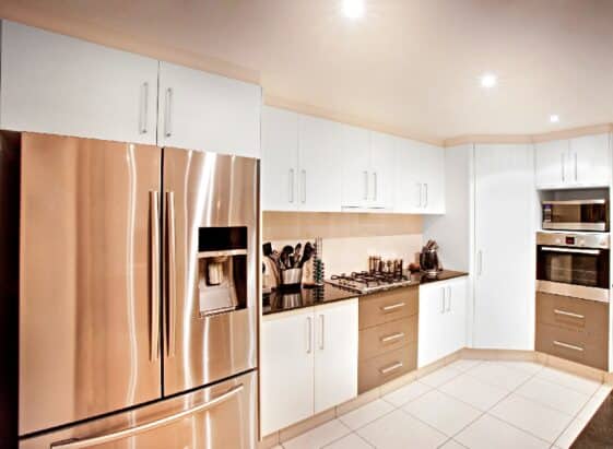 Refrigerator Next to Stove in Kitchen